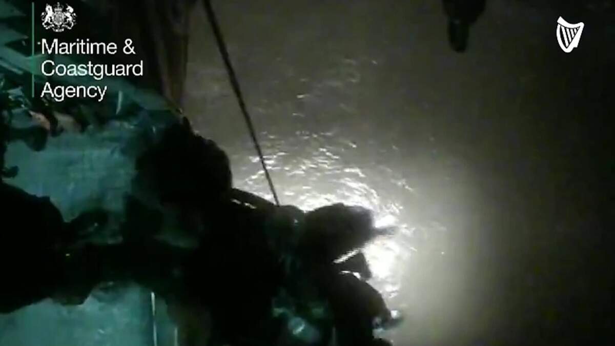 Four people and two dogs rescued by coastguard after tide cuts off ...