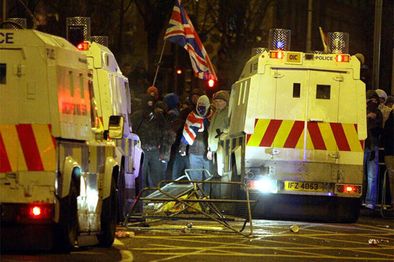 Protesters attempt to storm Belfast city hall after flag vote | Irish ...