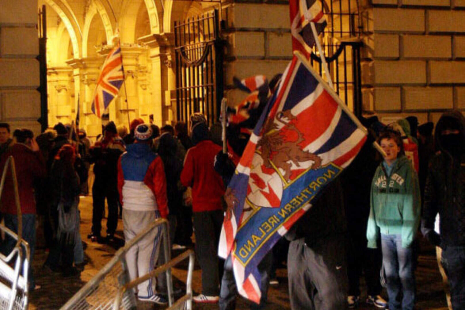 Protesters attempt to storm Belfast city hall after flag vote | Irish ...
