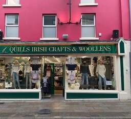 Iconic Kerry chain Quill’s cut off clothing labels with scissors to ...