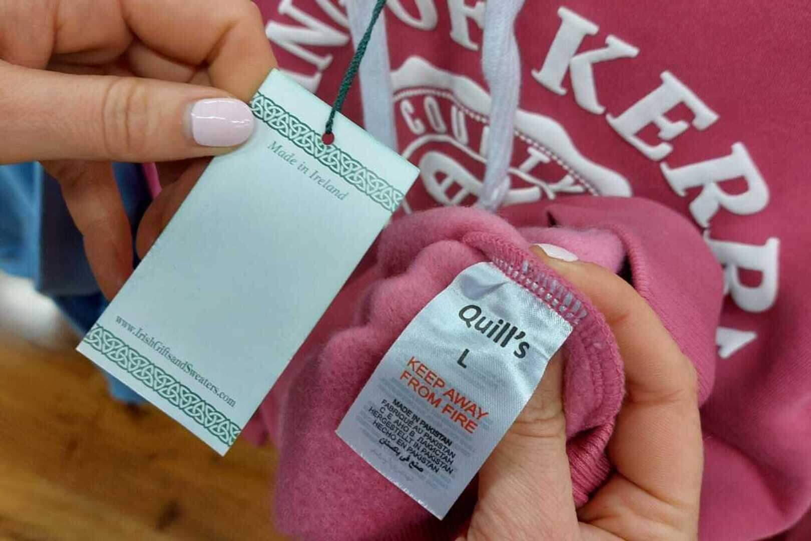 Iconic Kerry chain Quill’s cut off clothing labels with scissors to ...