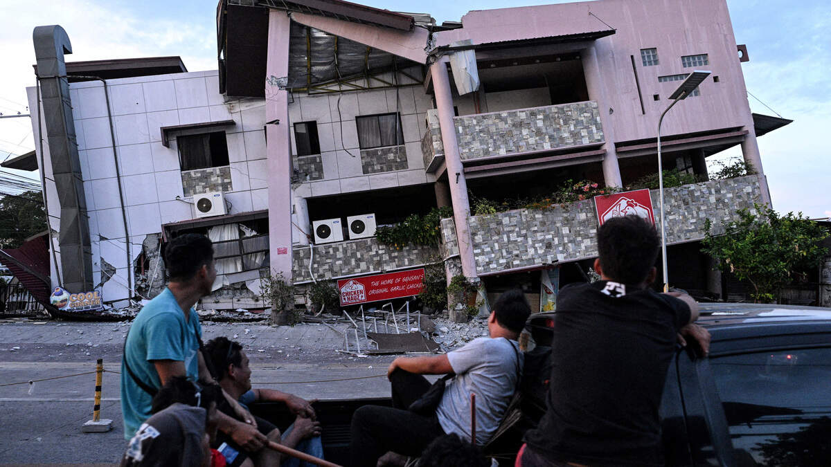 Rescuers race to reach people trapped after powerful quake in southern ...