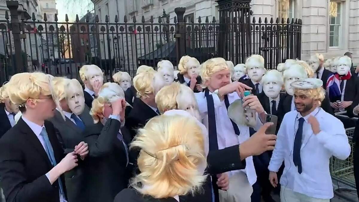 Group of Boris Johnson 'look-a-likes' hold party outside Downing Street ...