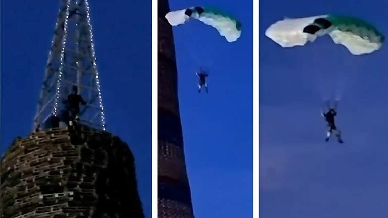 Man parachutes off 200ft bonfire | Irish Independent