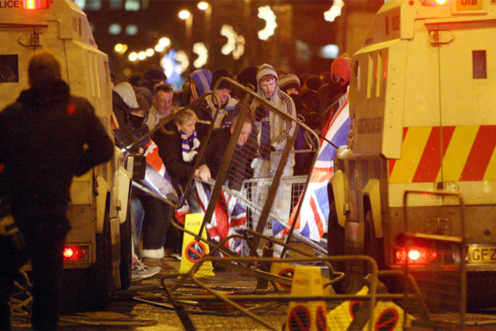 Protesters attempt to storm Belfast city hall after flag vote | Irish ...