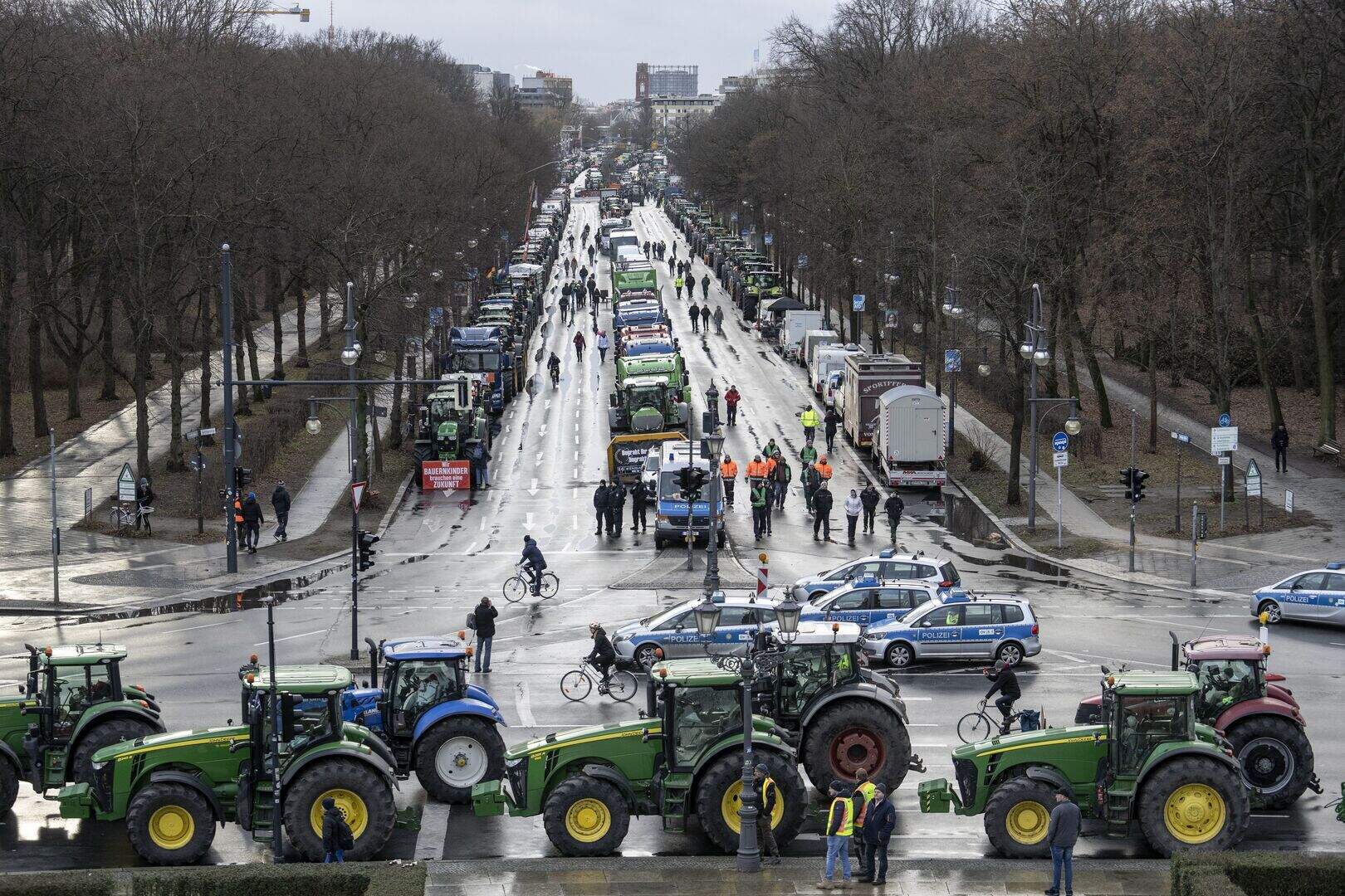 Farmers drive thousands of tractors into Berlin in fuel subsidy cuts ...